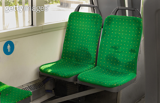 Green passenger chairs in public bus. Vacant subway wagon with free ...