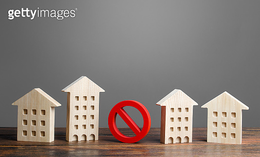 A red prohibition sign no stands among residential buildings ...