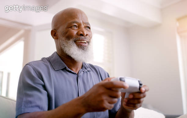 Arcade, gamer or happy old man gaming on a tv to relax with freedom or ...