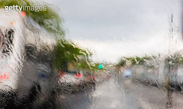 Driving on Queens Boulevard, New York, under torrential rain. The view ...