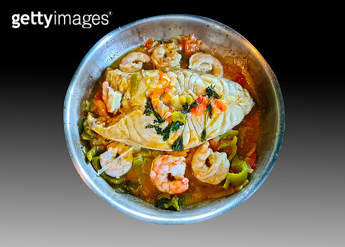 Moqueca, a traditional Brazilian dish with badejo fish and large shrimp ...