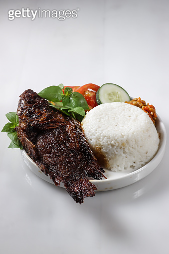 Grilled Tilapia and rice, Indonesian traditional grilled nille tilapia ...