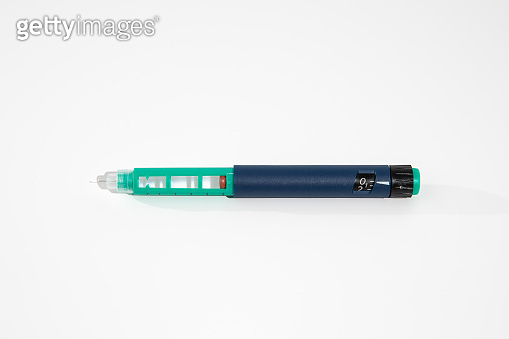 Insulin pen with needle tip isolated on white background. Medical ...