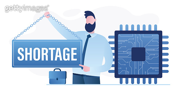 Semiconductor shortage. Big microchip. Businessman holds placard ...