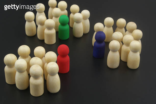 Wooden people figures divided into groups with leaders. (1369717763 ...