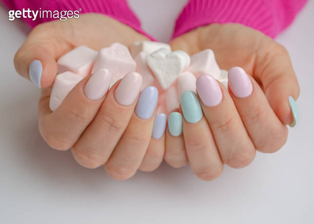 Beautiful female hands with delicate manicure and marshmallows. Spring ...