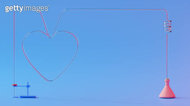Test tube and lamp and heart shape glass tube on blue background. Heart ...