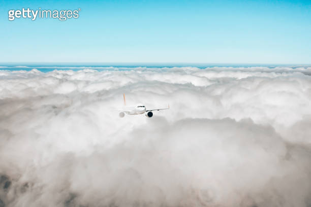 Commercial Jet airplane flying over clouds. 이미지 (1394534218) - 게티이미지뱅크