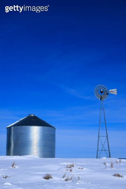 Windmill and Grain Silos in Winter Snow on Farm for Agricultural ...