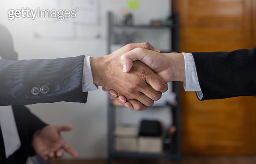 Client And Agent Shaking Hands, manager handshake with new employee ...