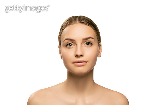 Portrait of young female fashion model without makeup isolated on white ...