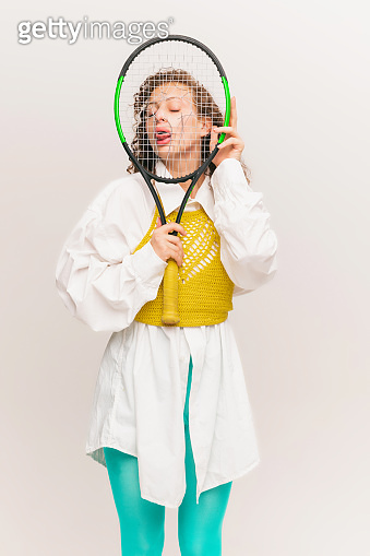 Portrait of young beautiful astonished girl in avant-garde style over ...