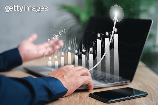 Business finance technology investment concept,businessman and graph ...