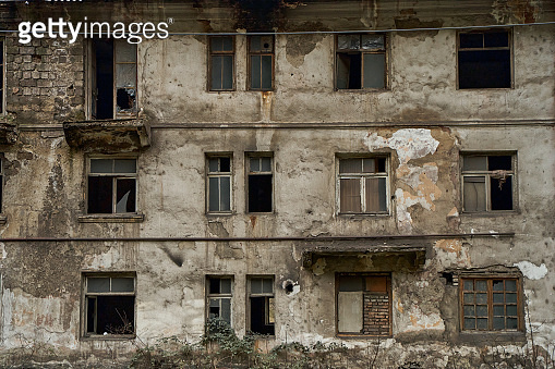 Abandoned crumbling buildings in a residential city. A dying city ...