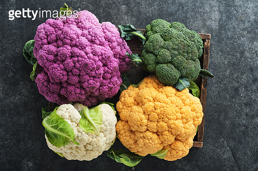 Colorful cauliflower. Various sort of cauliflower on old dark gray ...
