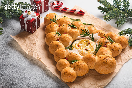 Bread buns Christmas tree with Roasted camembert cheese and rosemary on ...