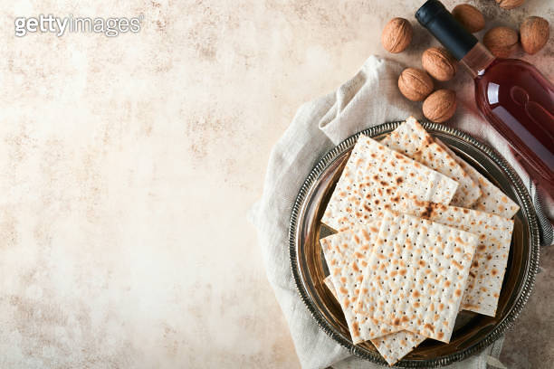 Passover celebration concept. Matzah, red kosher and walnut ...