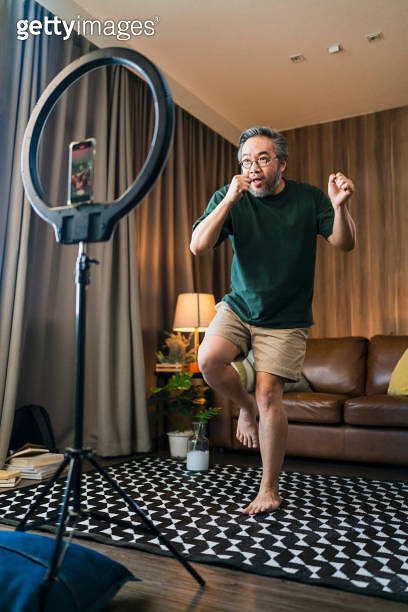 happy male vlogging recording dance broadcast on social media ,Man ...