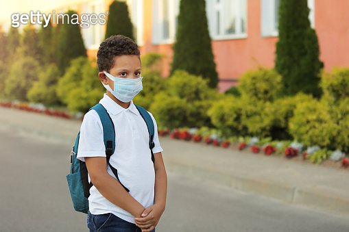 School child wearing face mask during corona virus and flu outbreak ...