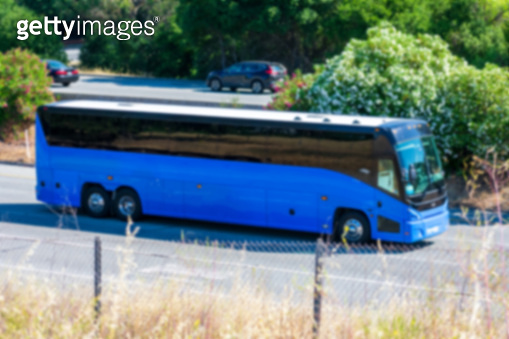 Blurred blue coach bus is driving on highway 이미지 (1398238582) - 게티이미지뱅크