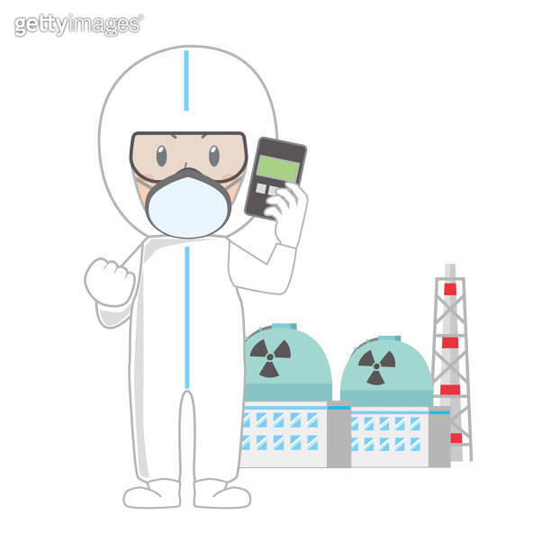 Nuclear power plant worker wearing protective clothing with a dosimeter ...