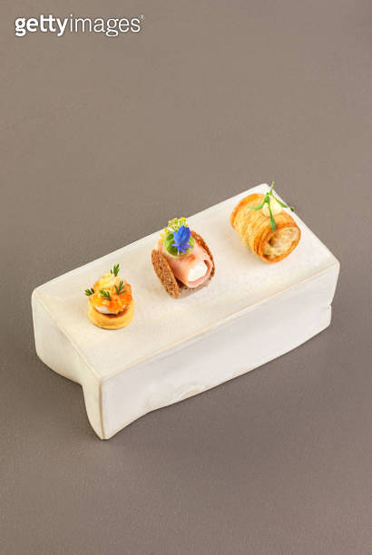 Elegant Canapé Appetizer Amuse Bouche food with salmon, caviar and ham ...