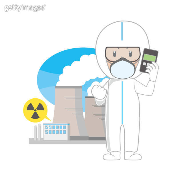 Nuclear power plant worker wearing protective clothing with a dosimeter ...