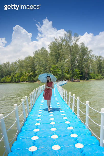 young female tourist asian holding umbrella protect sunlight sunny day ...