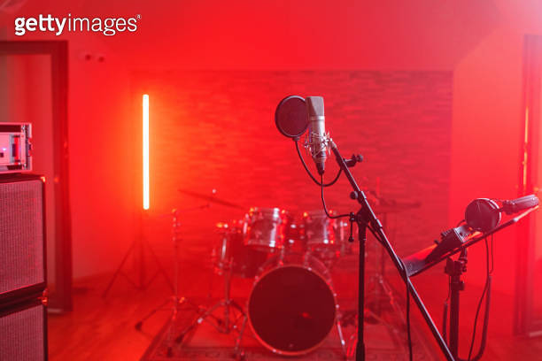 Beautifully Illuminated Red Recording Studio Filled With Various Music ...