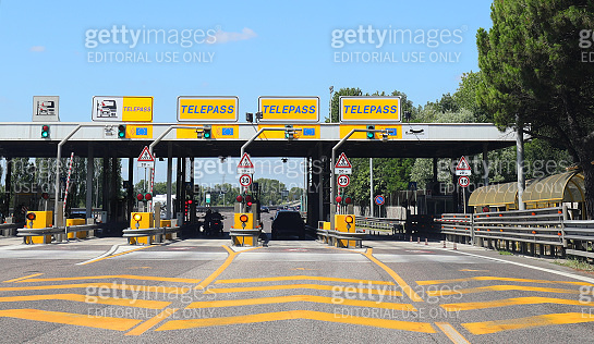 motorway toll booth with the text TELEPASS indicating the gate for the ...