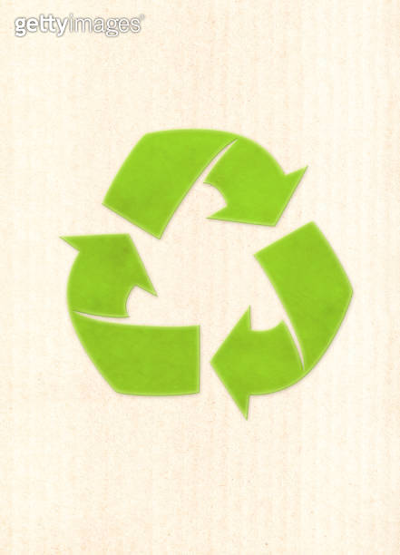 Arrows recycle symbol on striped cardboard texture. Vertical banner ...