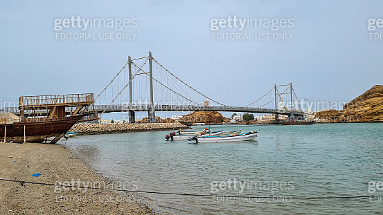 Boats at Al-Aijah Bridge on the coastline of the picturesque ...
