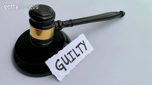 Law and order concept. Top view of judge gavel with with guilty text on ...