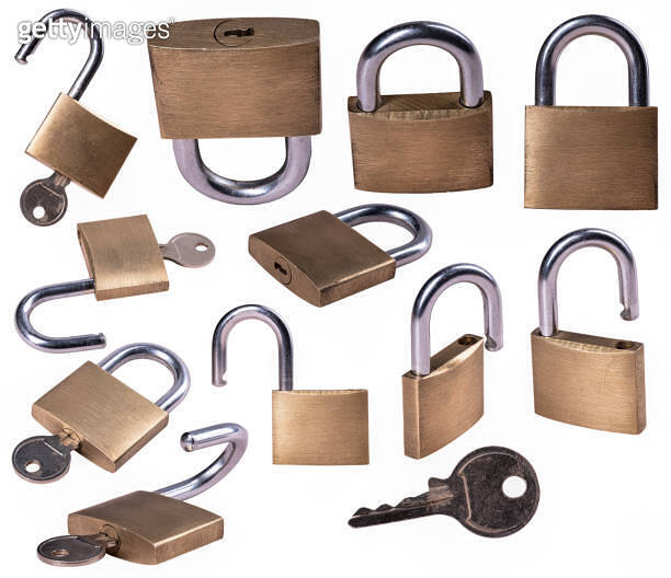 A padlock with a key for locking and securing doors and devices against ...