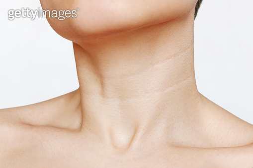 Close up of young woman's neck with lines isolated on a white ...