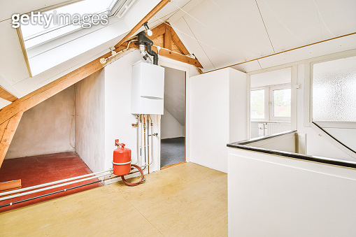 Boiler and window in mansard room 이미지 (1409369433) - 게티이미지뱅크