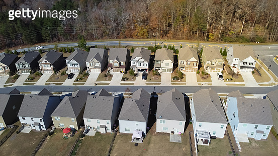 Aerial view new residential street and service road in upscale HOA ...