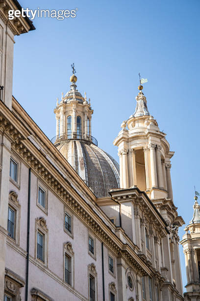 Marble pillars, spires, and statues that are typical of churches in ...