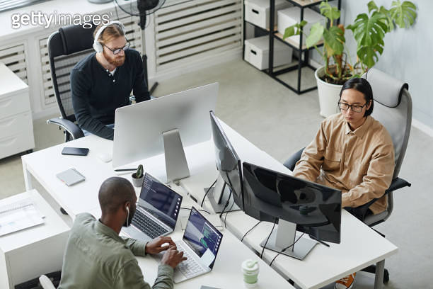 Group of young intercultural diversity programmers developing new ... Group of young intercultural diversity programmers developing new ...