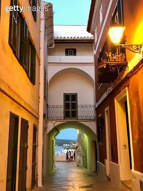 Spain - Minorca- Port Mahon- little street and view on the old town of ...