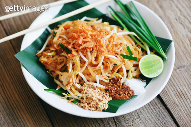Stir-fry noodle Pad Thai on plate served on the dining table food, Thai ...