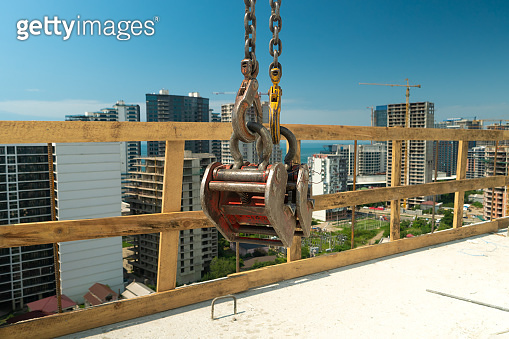 Close-up of a construction crane mounting grab on a construction site ...
