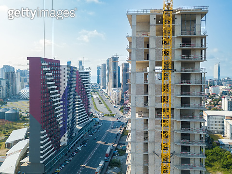Drone view of an almost completed residential multi-storey building ...