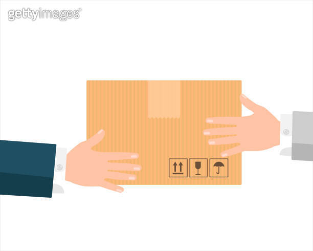 Delivery man`s hands giving cardboard package to client. Handing over ...