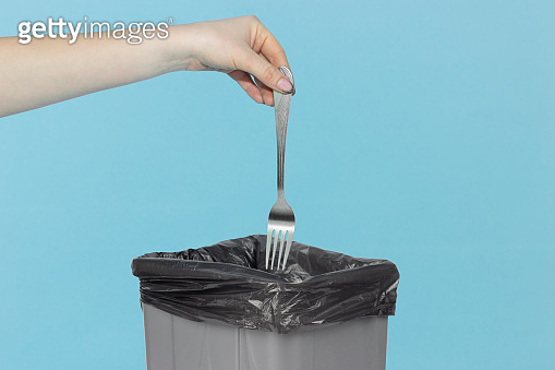 throw fork in trash can, fork in hand in front of trash can, diet ...