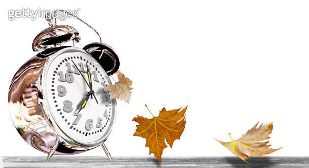 autumn leaves falling, time clock alarm seven o'clock isolated for ...