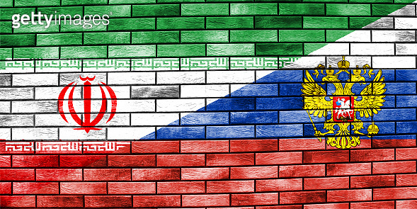 Flag of Russia and Iran on a brick wall. Concept of cooperation between ...