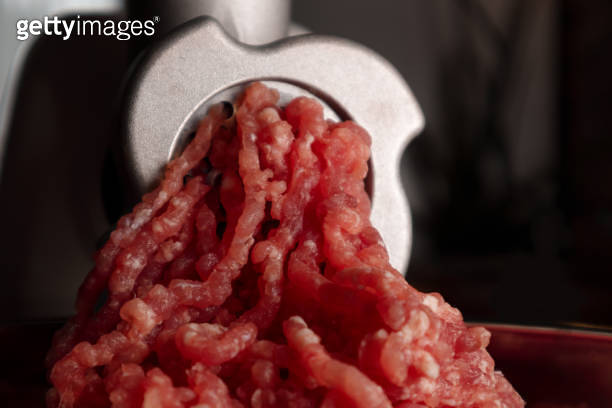 Process of preparing forcemeat by means of a meat grinder. Fresh red ...