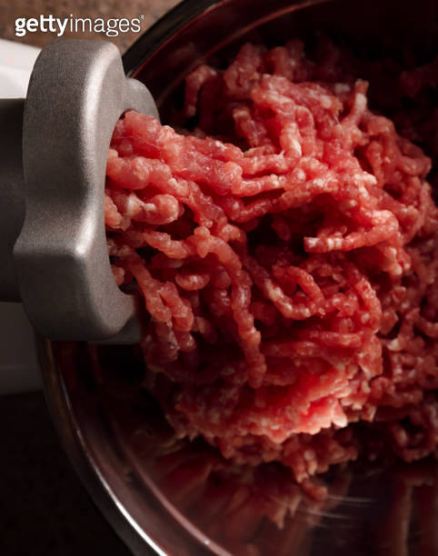 Process of preparing forcemeat by means of a meat grinder. Fresh red ...