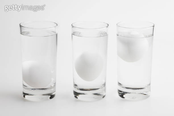 Eggs in water test on transparent glass , Egg freshness test on white ...